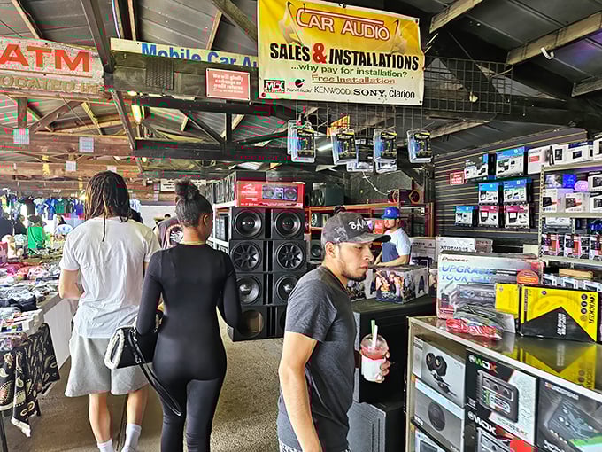 Shoppers explore the lively car audio and electronics area at US 1 Metro Flea Market.