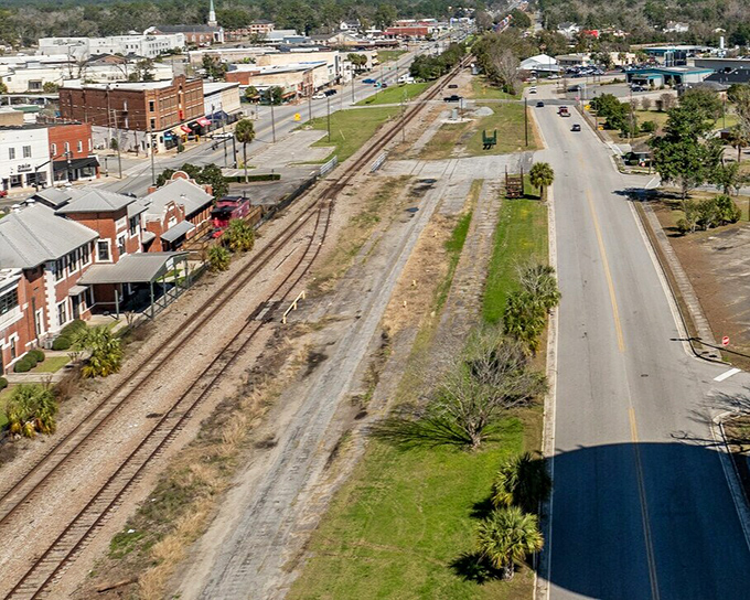 The view from above shows Waycross as nature intended—a community nestled among Georgia's green embrace.