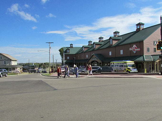 A large Amish-style marketplace with shoppers crossing the street - retail therapy with a side of genuine community.
