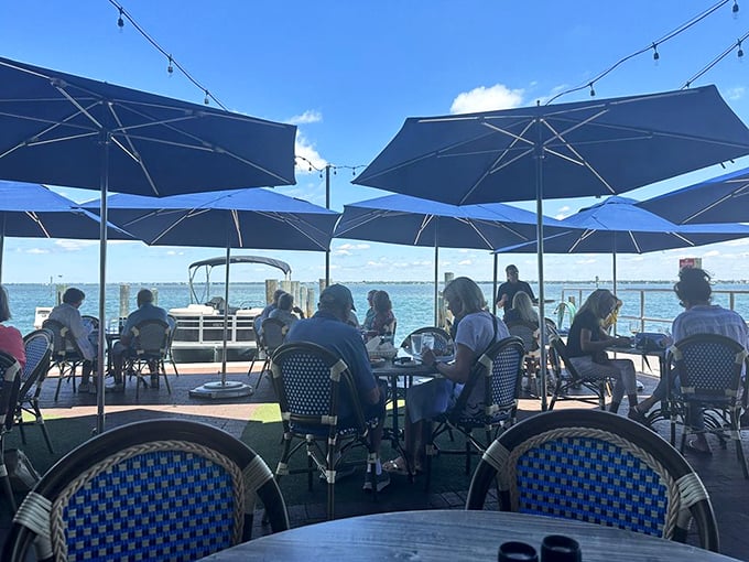 Those green umbrellas and string lights transform dinner into an event worth writing home about. 