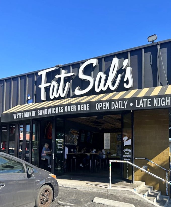 The industrial storefront hints at serious sandwich construction happening behind those unassuming walls.