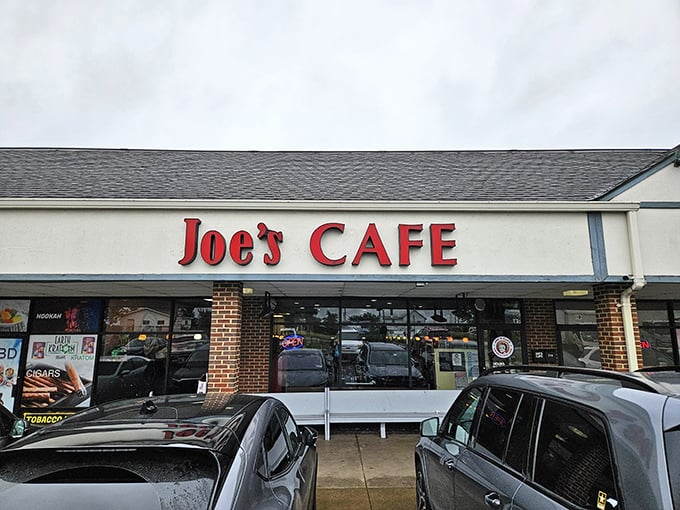 That simple red sign doesn't need to shout—the regulars filling the parking lot tell the real story.