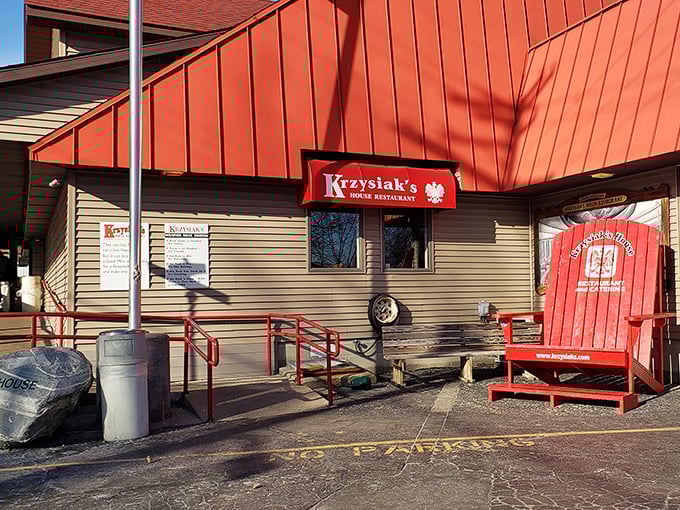 That oversized red chair isn't just cute—it's where you'll want to sit after consuming your weight in perfectly fried chicken.