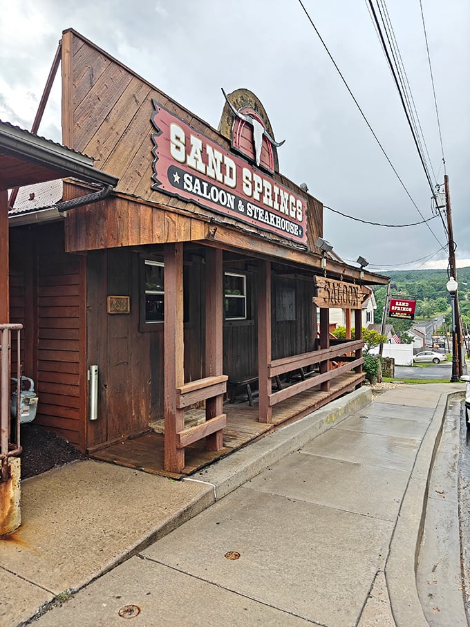 The wooden facade of Sand Springs promises an authentic experience—like stepping into a frontier saloon where the steaks are the real gold.