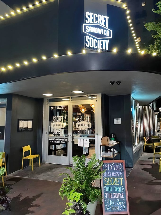 The modern lighting and dark interior create an atmosphere where every sandwich feels like a special discovery.
