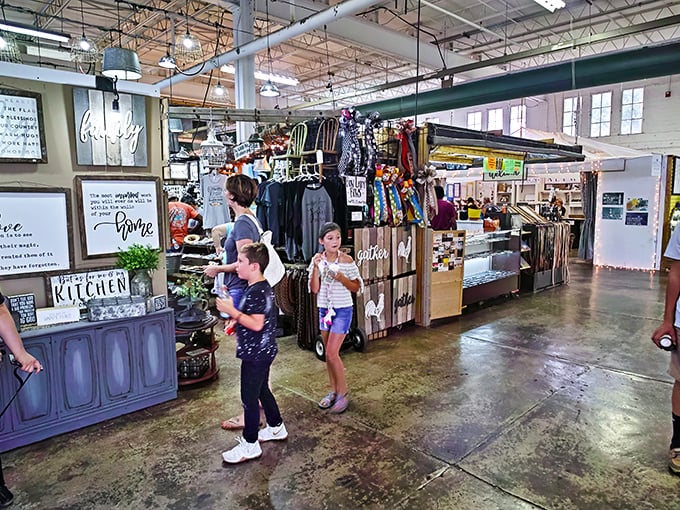 Inside these industrial walls, vendor booths stretch endlessly like a shopping mall from heaven above.