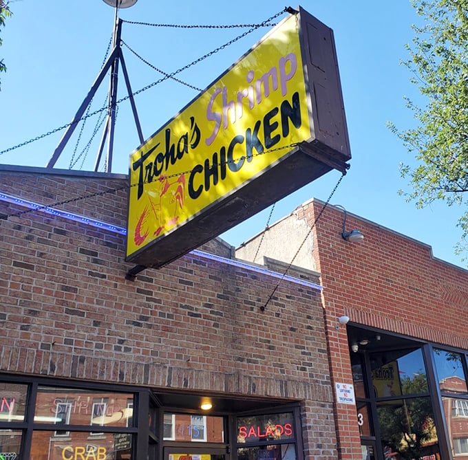 Daylight reveals Troha's brick facade and iconic sign – a neighborhood landmark that's been feeding generations of seafood lovers.