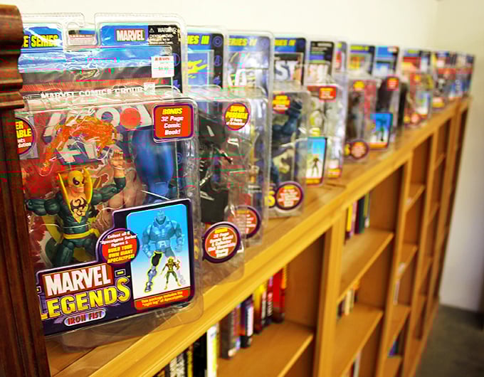 Superhero figures stand at attention, ready for new adventures. These plastic protectors cost a fraction of their original price—no origin story required.