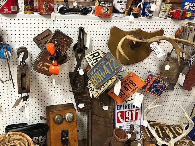 Vintage license plates and antique telephones—communication devices from when "texting" meant sending a telegram and waiting three days for a reply.
