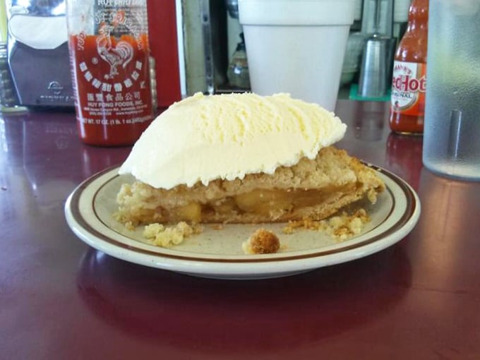 This slice of apple pie with a scoop of vanilla ice cream isn't just dessert—it's the American dream on a plate.