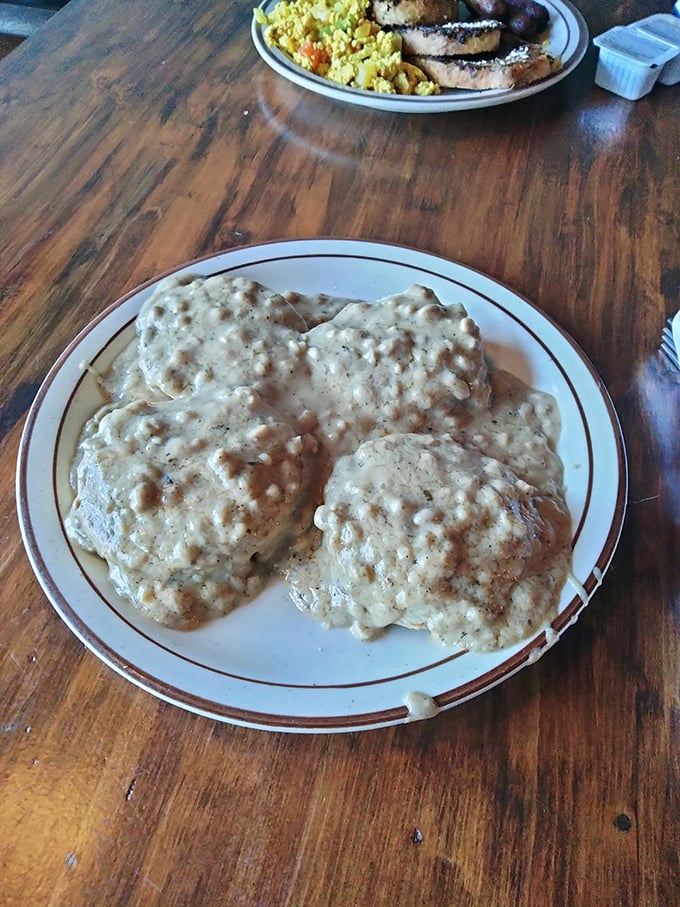 Biscuits and gravy that would make your Southern grandmother nod in approval—pillowy clouds of dough swimming in savory, peppery gravy.