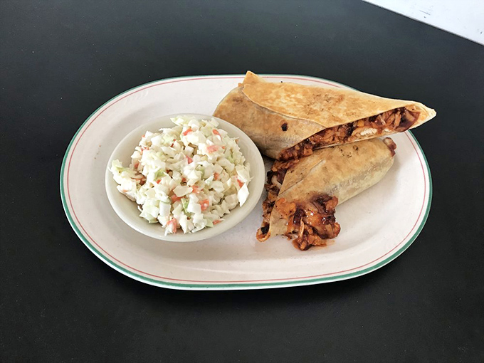 This wrap isn't just lunch—it's a perfectly engineered flavor delivery system, with coleslaw standing by as the unsung hero of the plate.