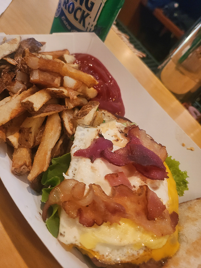 The perfect breakfast burger doesn't exi— Oh wait, here it is, complete with a sunny-side-up egg that's basically wearing a cape. Those fries aren't sidekicks; they're co-stars.