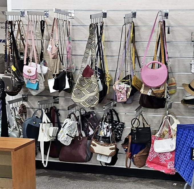 Handbag heaven! Designer dreams and practical purses hanging side by side—the ultimate democratic fashion statement.