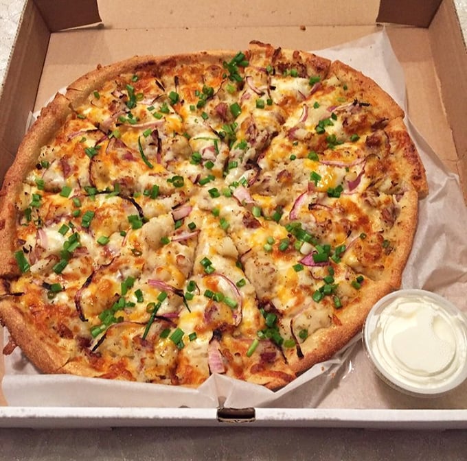 This isn't just pizza—it's a canvas where potato, cheese, and herbs create a masterpiece that would make any Italian grandmother nod approvingly.
