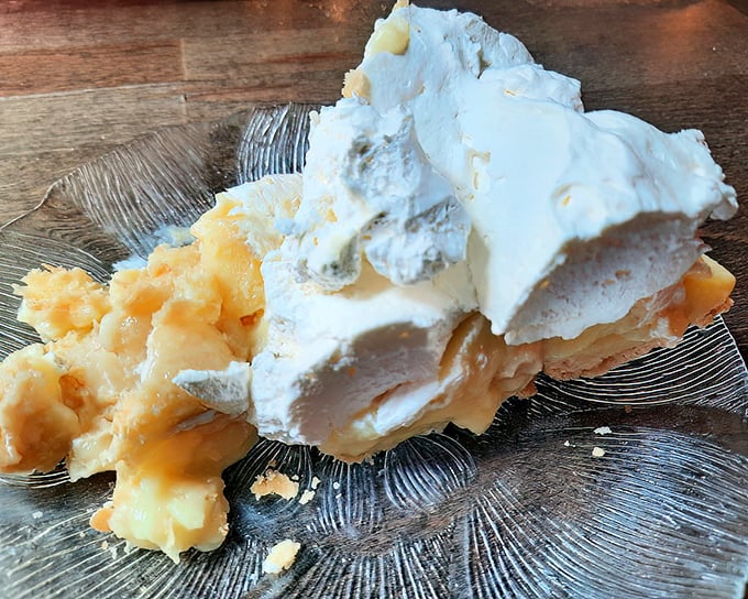 Banana cream pie so heavenly it should require a permission slip. That mountain of whipped cream isn't just a topping—it's a lifestyle choice.