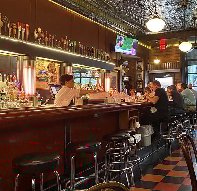 The bar at Tessaro's—where strangers become friends, friends become family, and everyone becomes a burger philosopher after round two.