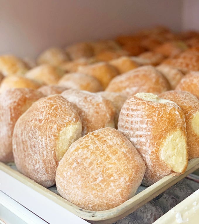 Bavarian-filled donuts – where the cream-to-dough ratio achieves mathematical perfection. Each bite delivers the custard payload you've been dreaming of.