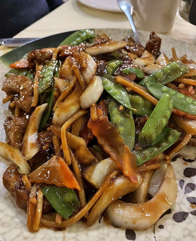 This isn't just beef chow fun—it's a masterclass in wok hei. Those charred edges and glistening sauce are telling you stories about proper heat control.