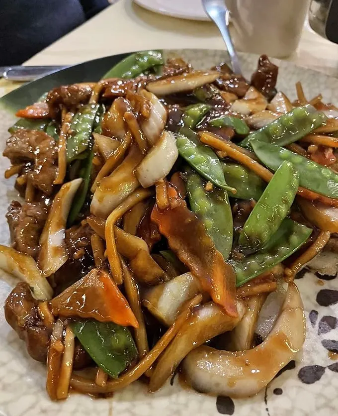 This isn't just beef chow fun—it's a masterclass in wok hei. Those charred edges and glistening sauce are telling you stories about proper heat control.