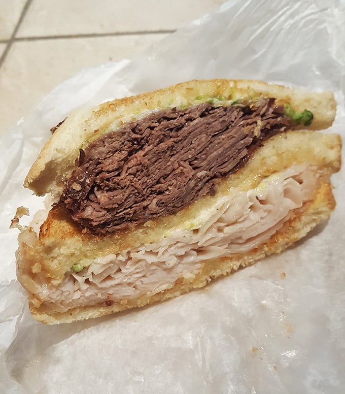 This double-decker sandwich contains enough protein to fuel a marathon, yet somehow you'll still find room for those gravy fries.