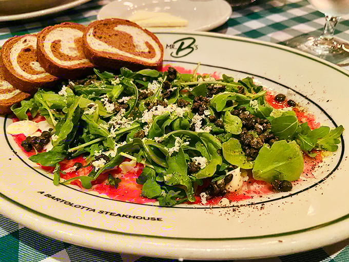 This carpaccio isn't just thinly sliced beef—it's a canvas where peppery arugula and sharp cheese create edible art that Picasso would envy.