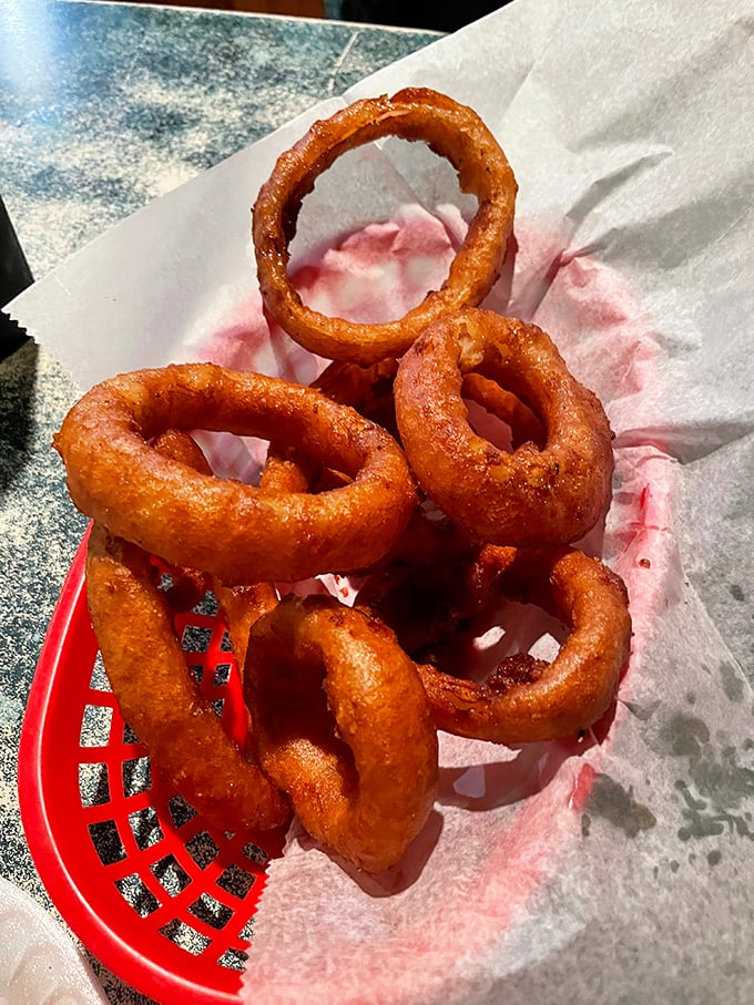 Onion rings with the perfect crunch-to-give ratio—each one a golden bracelet of flavor that makes vegetables worth eating.