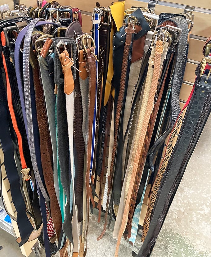 Belt heaven—where leather straps of every color and texture hang like pasta drying in an Italian kitchen. Fashion and function in perfect harmony.