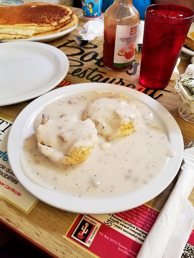 Biscuits swimming in a sea of peppery gravy – the breakfast equivalent of a warm hug from your favorite aunt who doesn't judge your life choices.