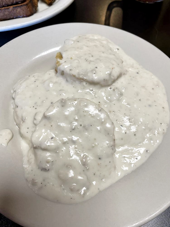 Biscuits swimming in creamy gravy—a breakfast so comforting it's like wearing your favorite sweater on the first chilly morning of fall.
