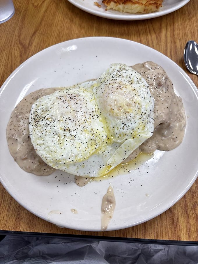 Fluffy biscuits drowning in creamy sausage gravy - comfort food that would make your grandmother weep.