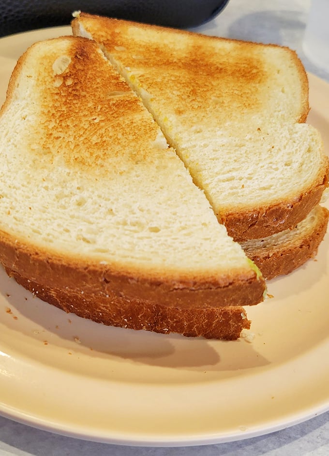 Golden-brown toast, perfectly bisected – the unsung supporting actor that deserves an Oscar in the breakfast drama unfolding on your plate.