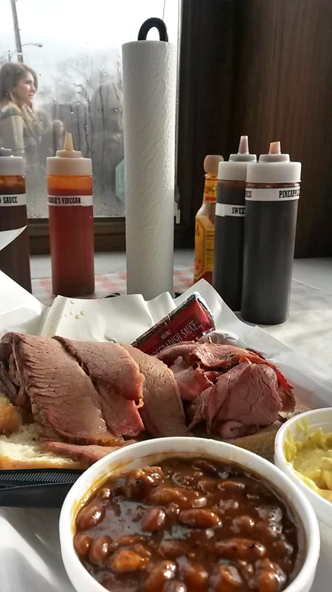 Brisket so tender it practically surrenders at the sight of your fork. The smoke ring tells the story of its long, flavorful journey.