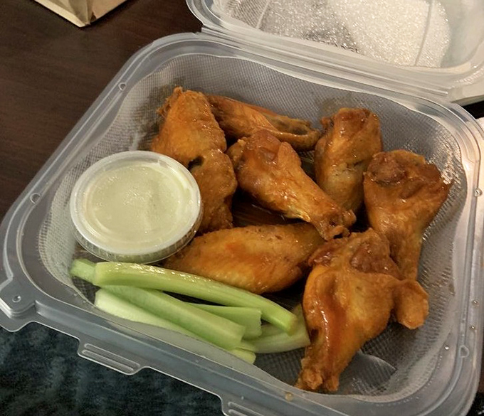 Wings that don't need gimmicky flavors or Instagram filters—just honest Buffalo heat, crispy skin, and the dignity of being served with proper celery sticks.