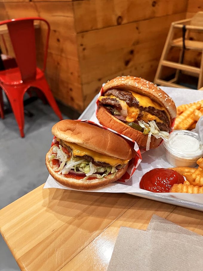 Two burgers that tell the whole story – perfectly melted cheese, fresh toppings, and buns that somehow manage to contain all that glory.
