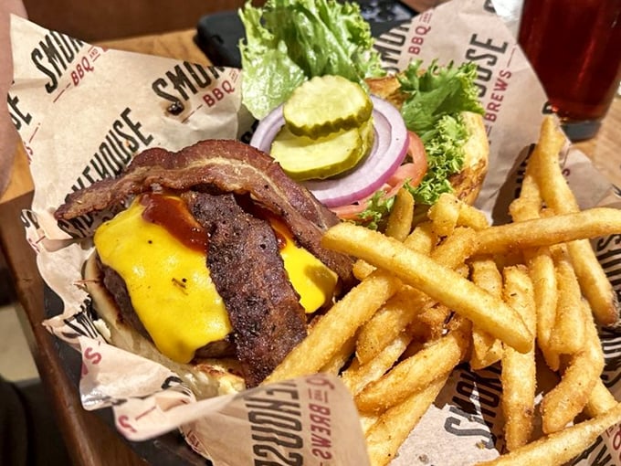 A burger that doesn't just sit there looking pretty – it demands your full attention with melted cheese and bacon that means business.