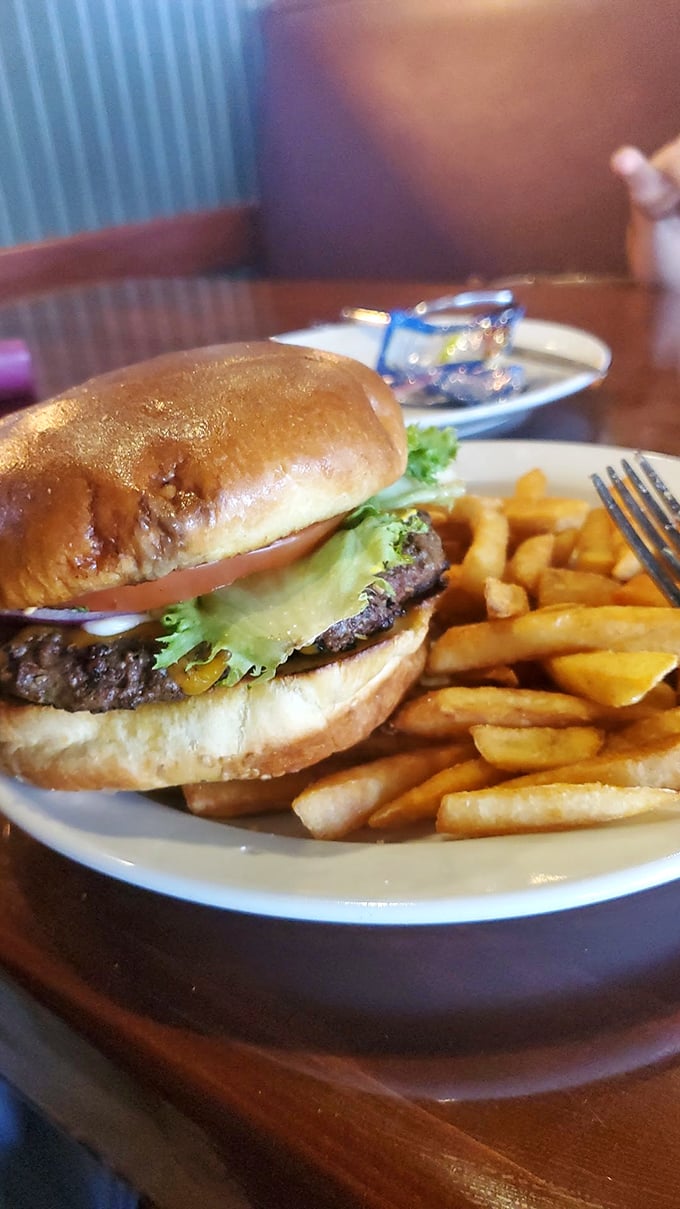 This isn't just a burger, it's architecture—a perfectly balanced tower of beef, cheese, and veggies that demands both respect and napkins.