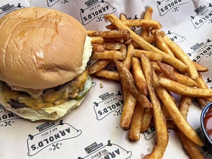 The burger that launched a thousand napkins. Juicy, substantial, and paired with fries that deserve their own fan club.