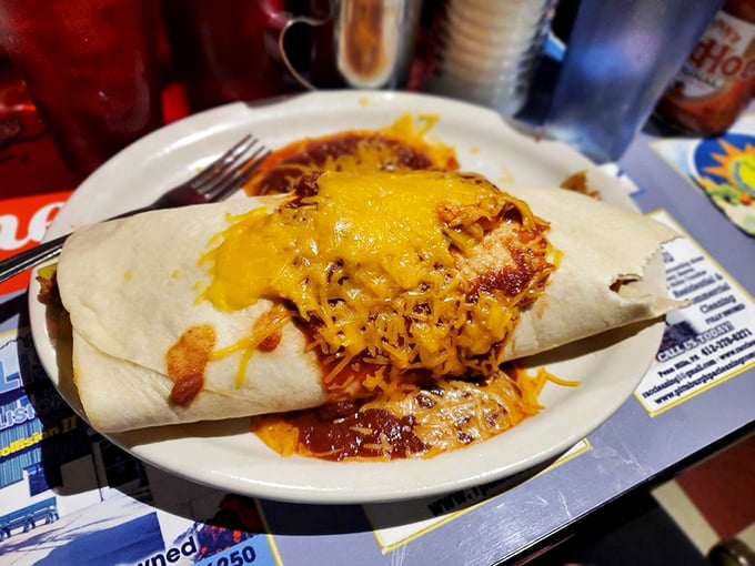 This isn't just a breakfast burrito—it's a hand-held festival wrapped in a tortilla and smothered in melted cheese.