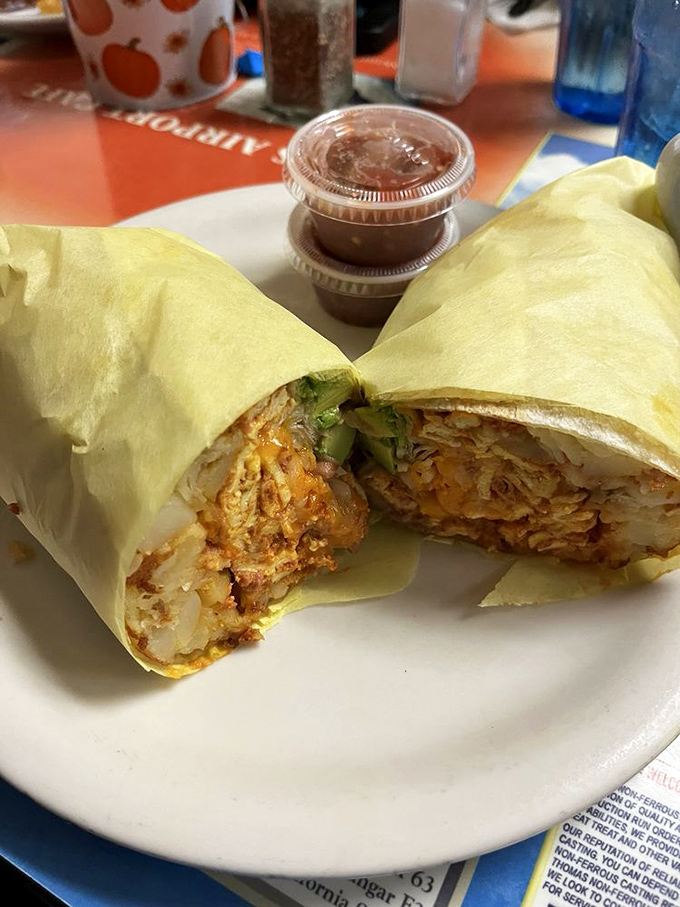 The breakfast burrito—where morning ingredients find themselves wrapped in a tortilla hug so perfect it should be studied by diplomats.