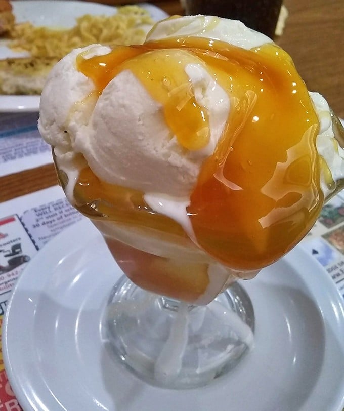 This butterscotch sundae isn't just dessert – it's what happiness would look like if it took physical form and came in a glass.