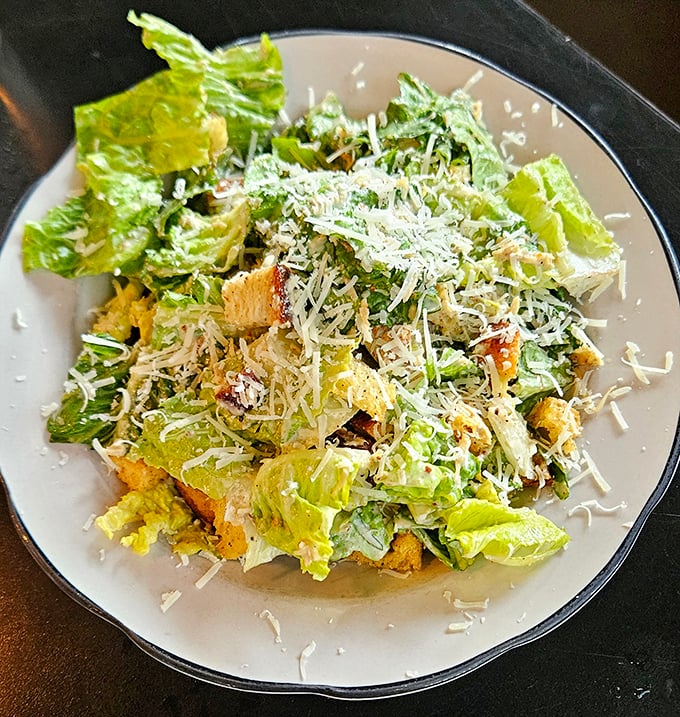A Caesar salad that Julius himself would approve—crisp romaine, generous Parmesan, and croutons that actually deserve to be there.