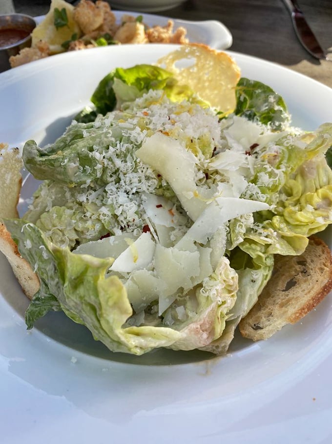 A Caesar salad that Julius himself would approve – crisp romaine, generous shavings of cheese, and croutons with actual crunch.