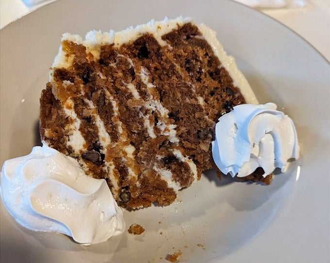 Carrot cake that makes vegetables feel like they're getting away with something naughty. Those cream cheese swirls are criminal in all the right ways.