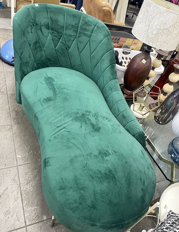 This emerald velvet chaise lounge isn't just furniture—it's the starting point for your "I found it at a thrift store" humble-brag story. 