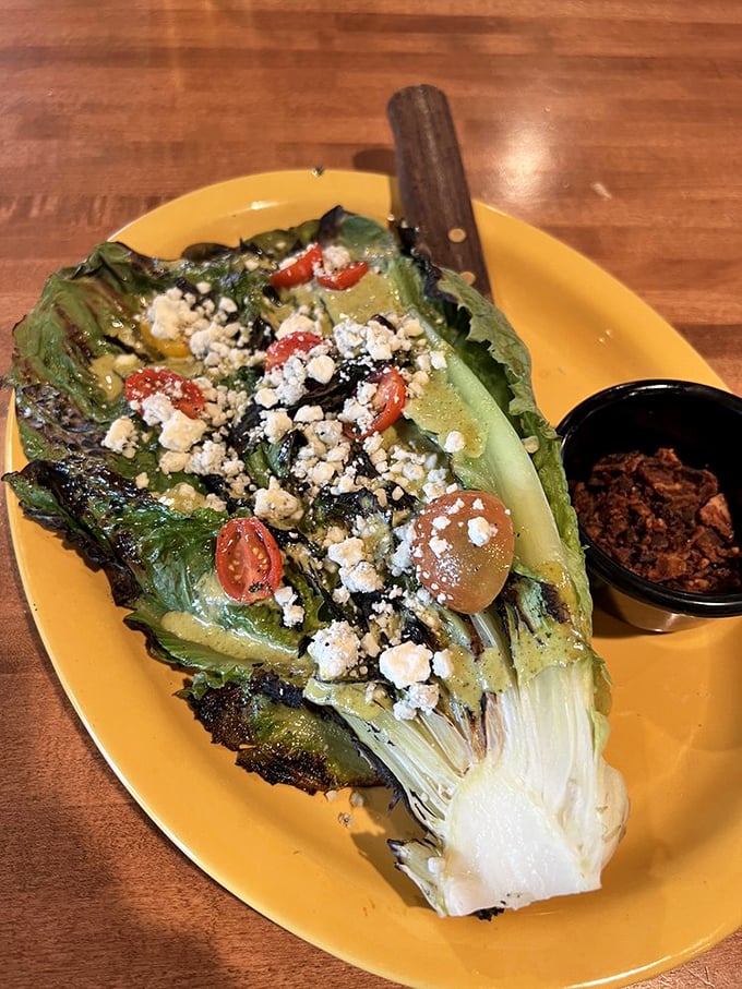 Charred romaine that proves vegetables can be the main character too. That smoky char transforms an ordinary salad into something extraordinary.
