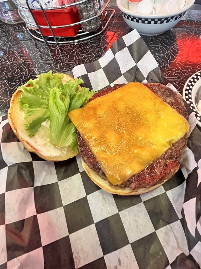 This isn't just a cheeseburger—it's a testament to simplicity done right. The melted cheese blankets the patty like it's tucking it in for a nap.