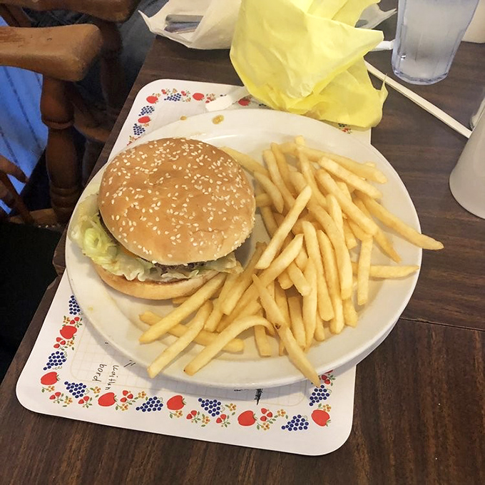 The classic American cheeseburger gets the Paula's treatment – simple, substantial, and served on plates with those charming Danish-inspired borders.