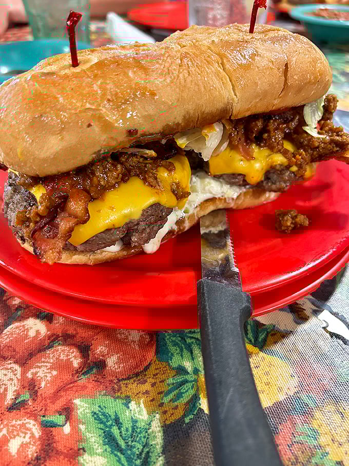 Not just a burger—a masterpiece of melty cheese, beef, and chili that requires both hands and several napkins.