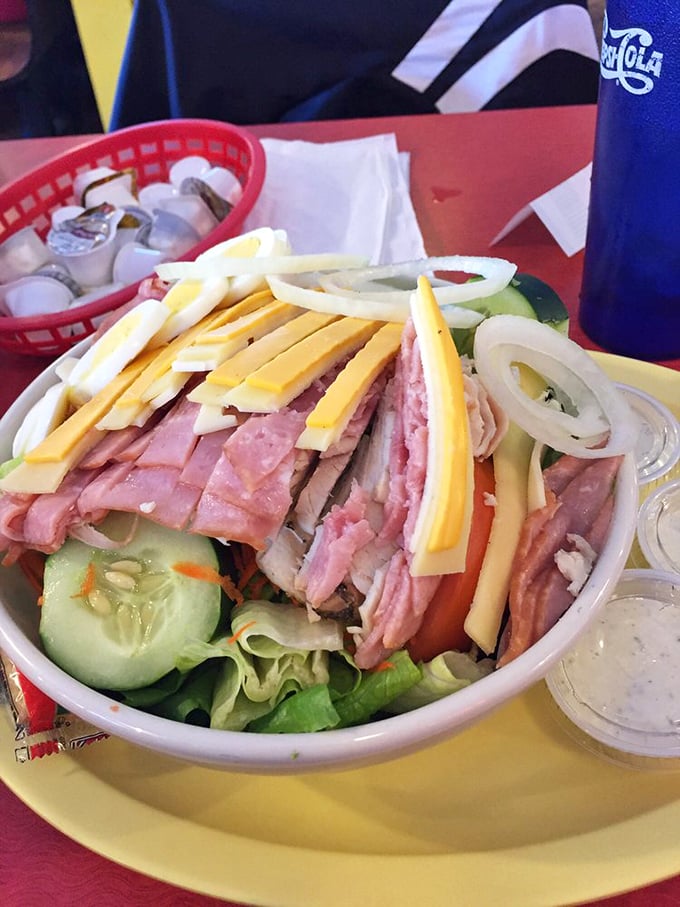 This chef salad isn't just lunch—it's edible architecture with layers of ham, cheese, and veggies creating a colorful skyline.